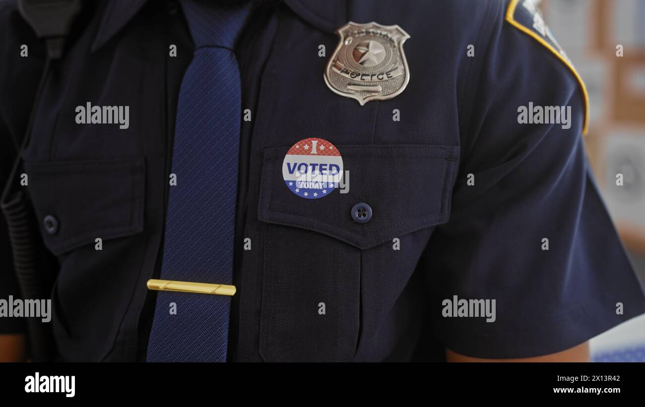 Close-up of an american police officer with a 'voted' sticker ...