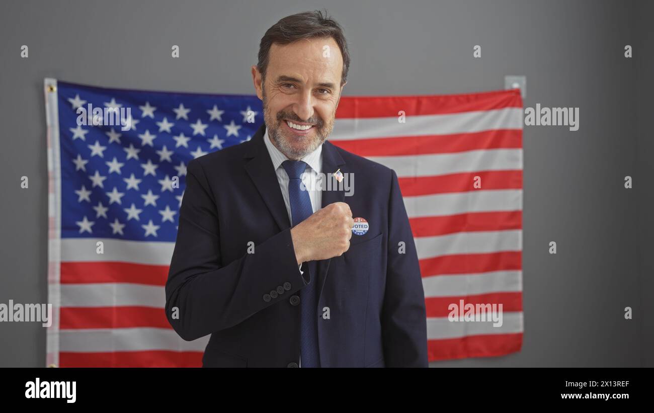 Smiling bearded man in suit displaying i voted sticker with american ...