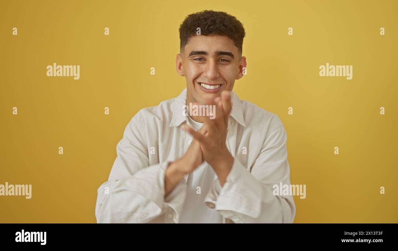 Man smiling clapping against bright hi-res stock photography and images ...