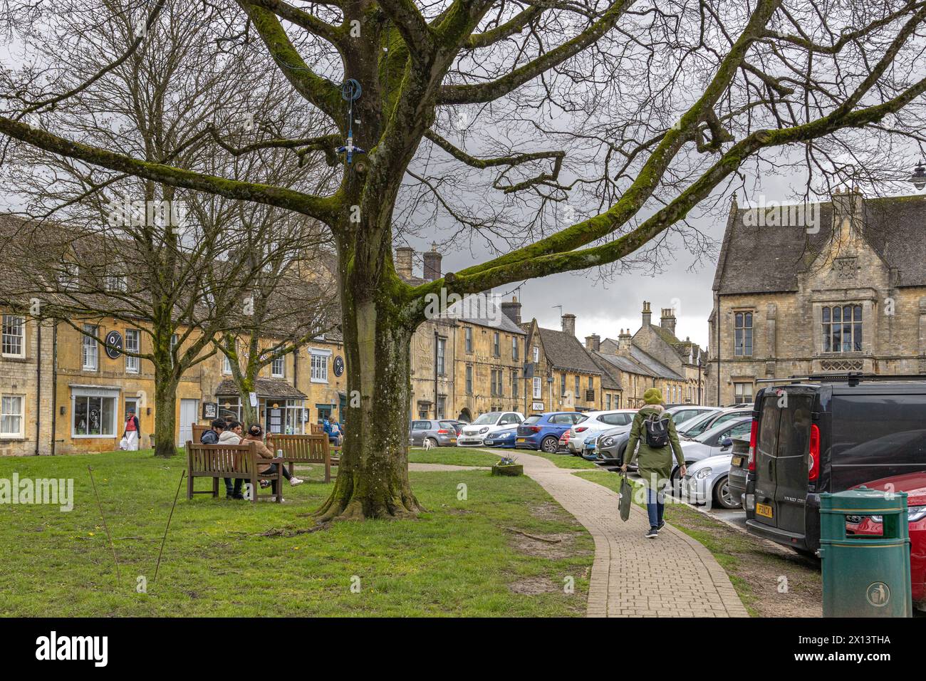 A street and green space in Stow on the Wold lined with Cotswold stone ...