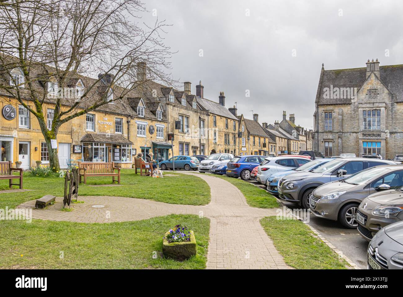 A street and green space in Stow on the Wold lined with Cotswold stone ...
