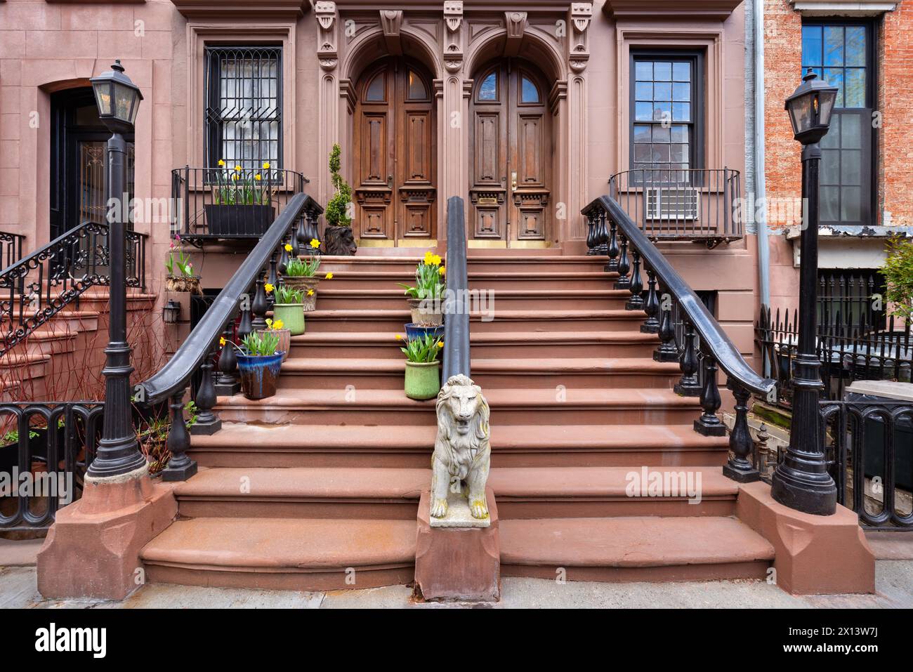 Brownstones with stoop steps in Chelsea Historic District. Row of ...