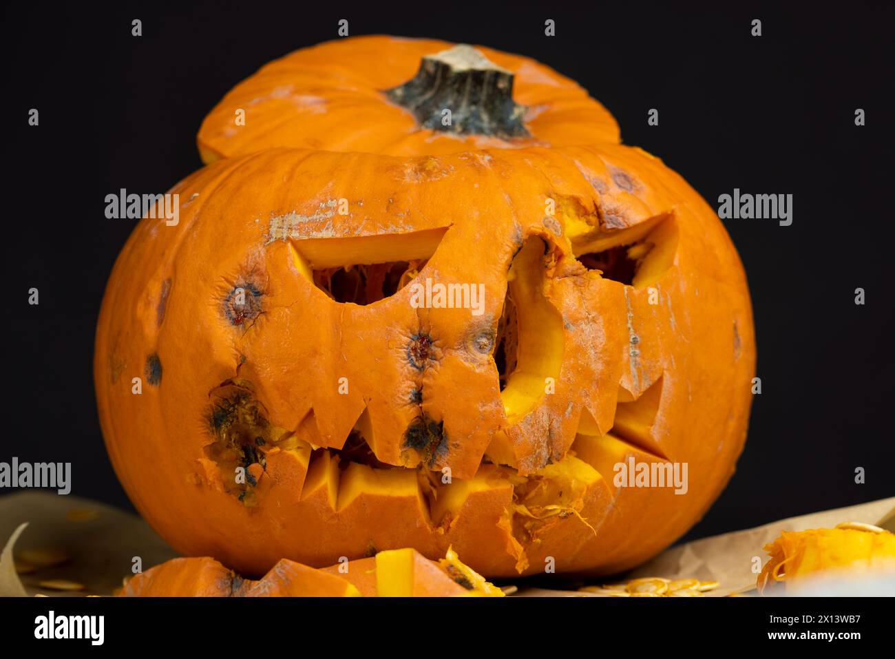 carved scary pumpkin head for Halloween, rotting orange pumpkin for ...