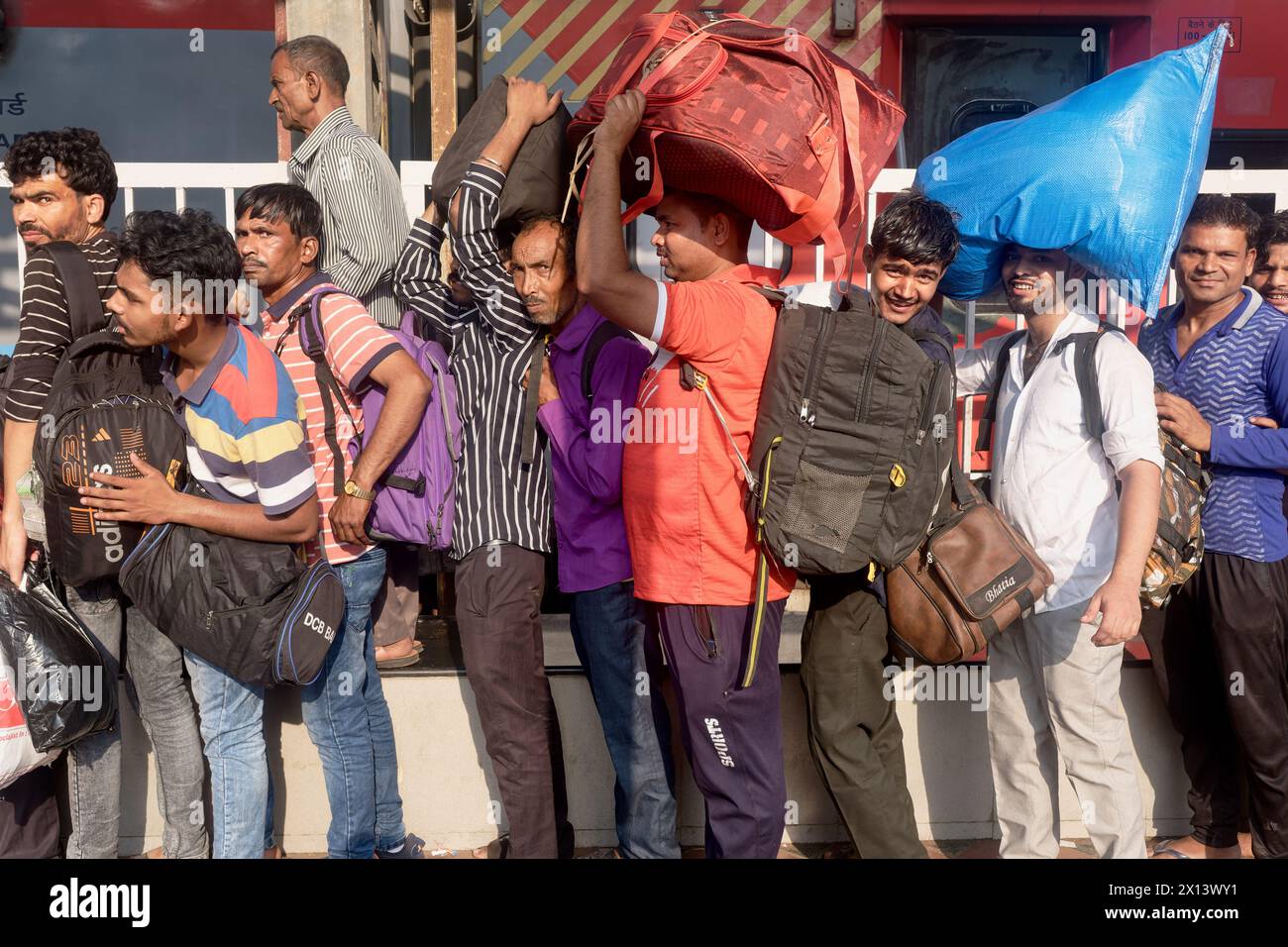 Migrant workers from Uttar Pradesh in North India queuing to board a ...