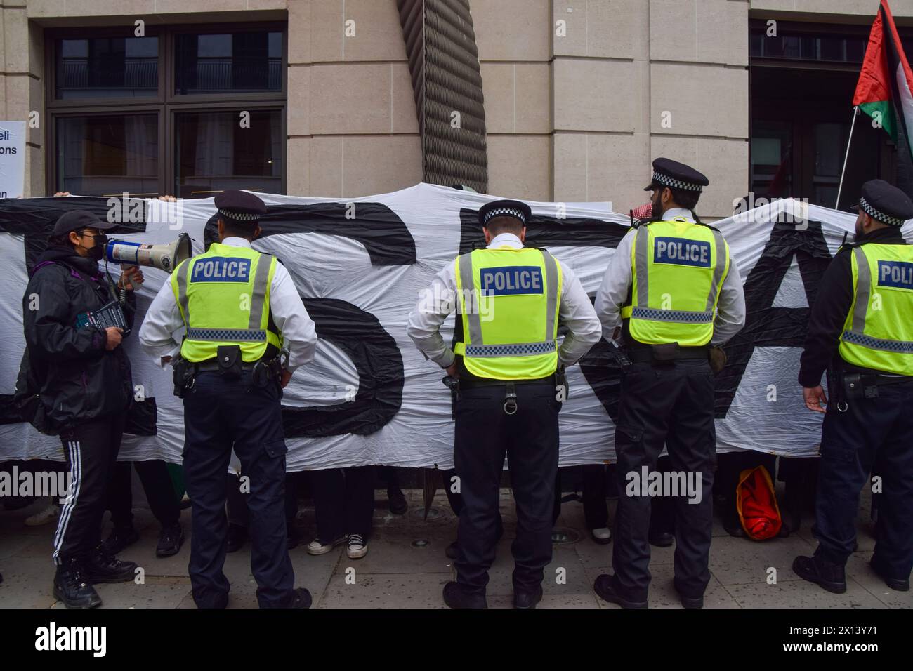 London, UK. 15th Apr, 2024. Police officers intervene as pro-Palestine ...