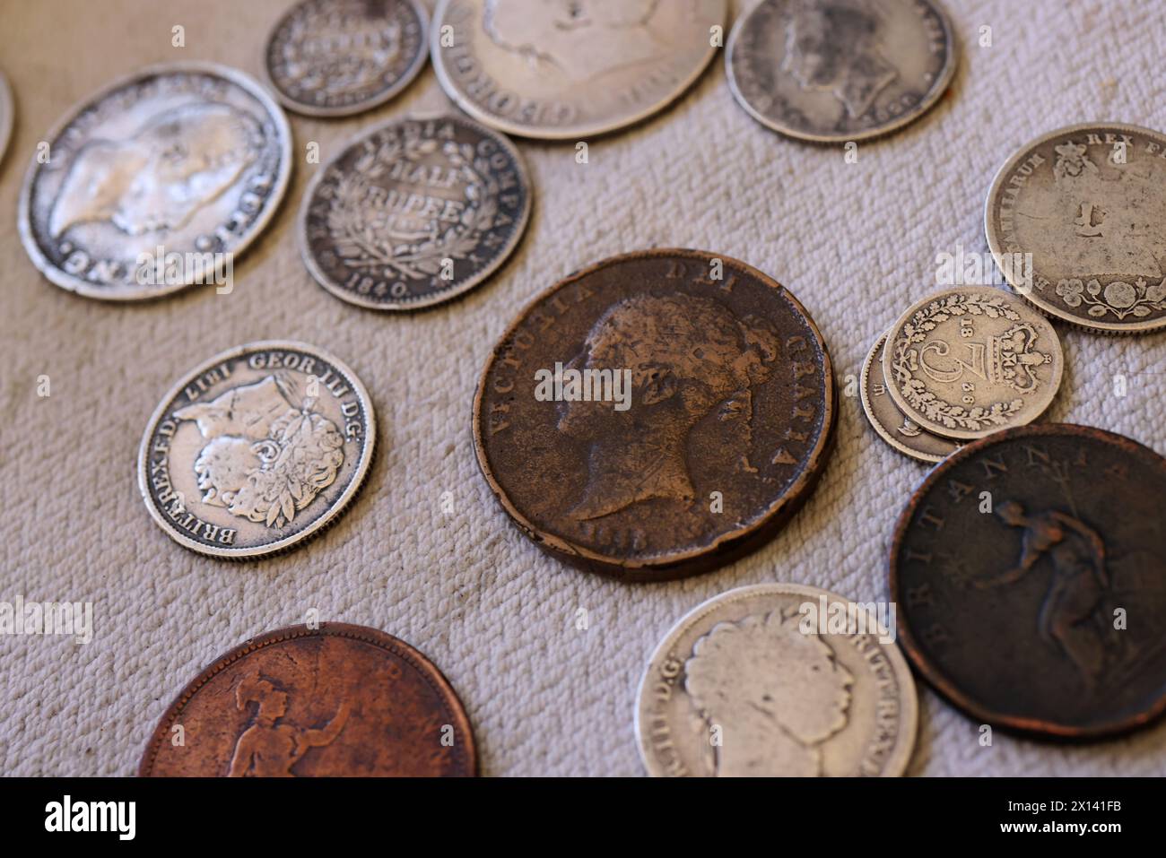 A selection of old British coins on a table at the Weald & Downland ...