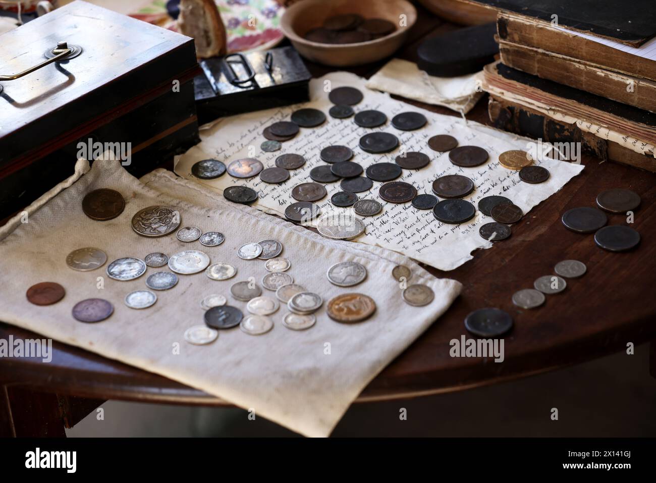 A selection of old British coins on a table at the Weald & Downland ...