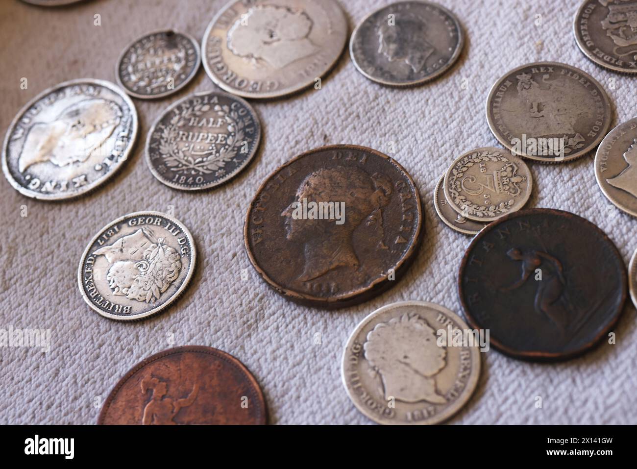 A selection of old British coins on a table at the Weald & Downland ...