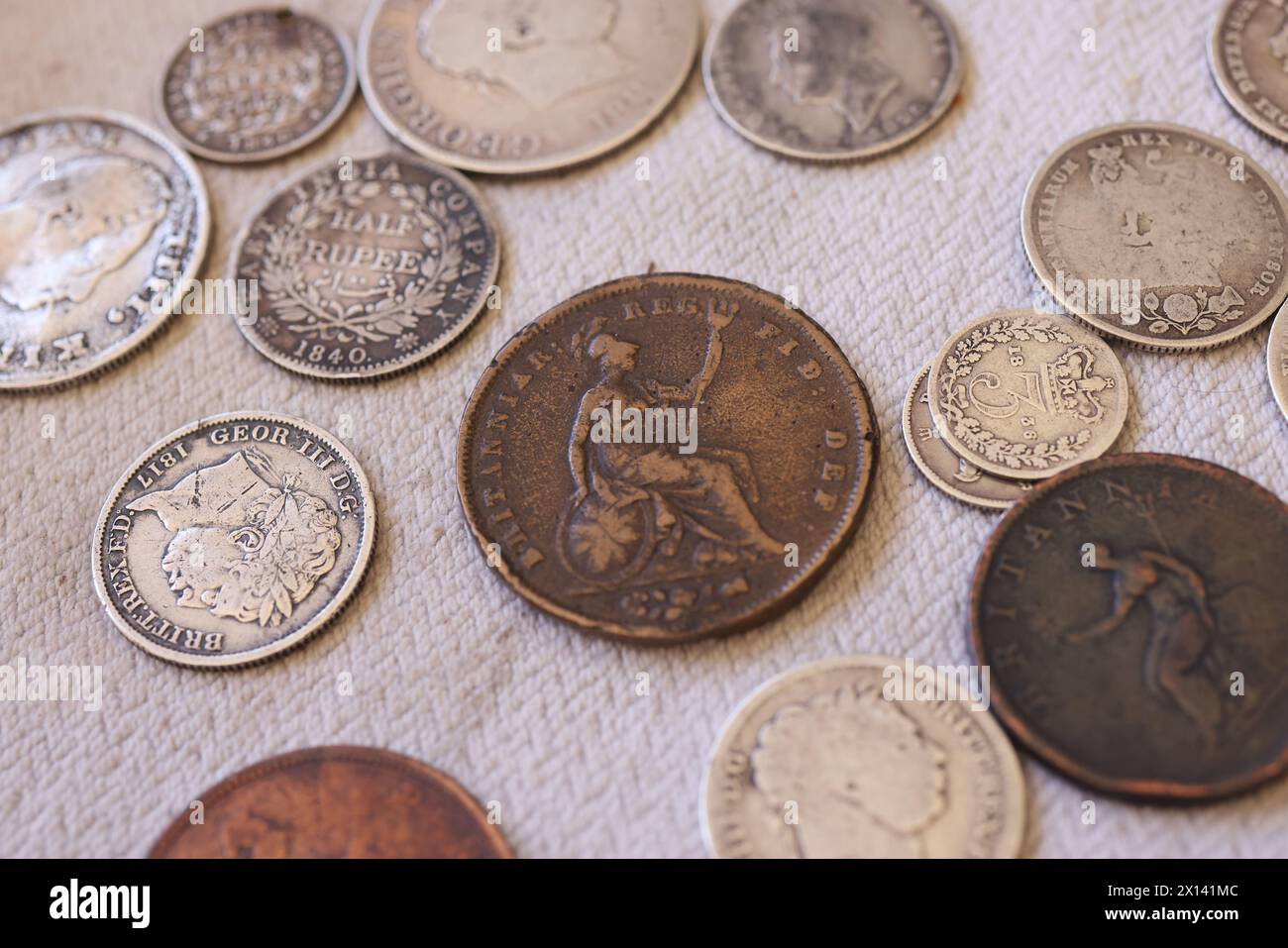 A selection of old British coins on a table at the Weald & Downland ...