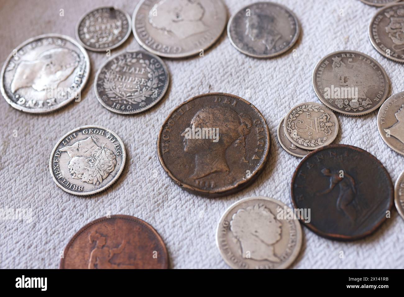 A selection of old British coins on a table at the Weald & Downland ...