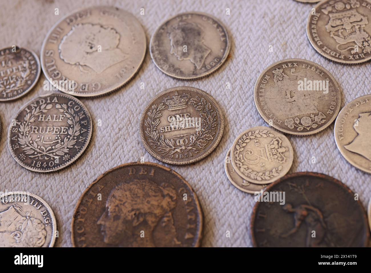 A selection of old British coins on a table at the Weald & Downland ...