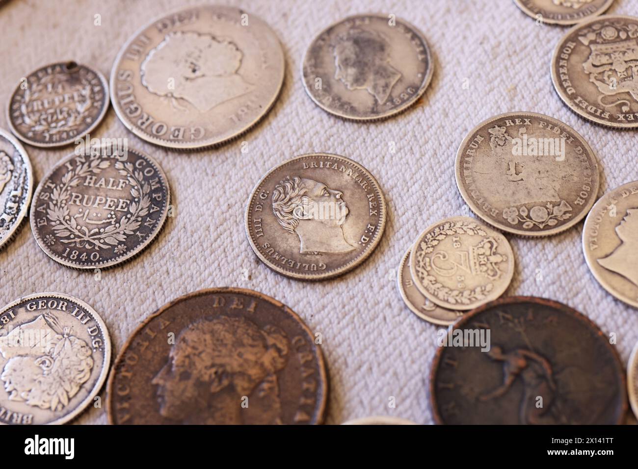 A selection of old British coins on a table at the Weald & Downland ...