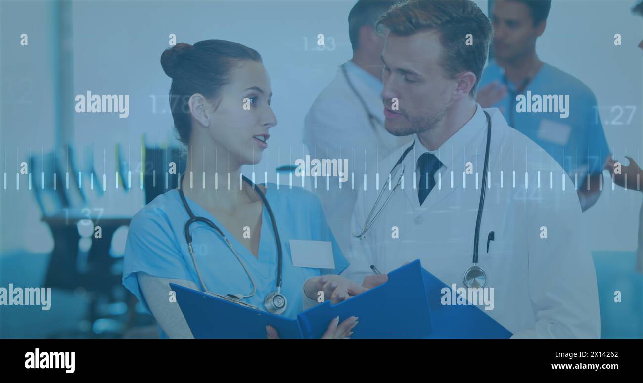 Image of financial data processing over diverse doctors Stock Photo - Alamy