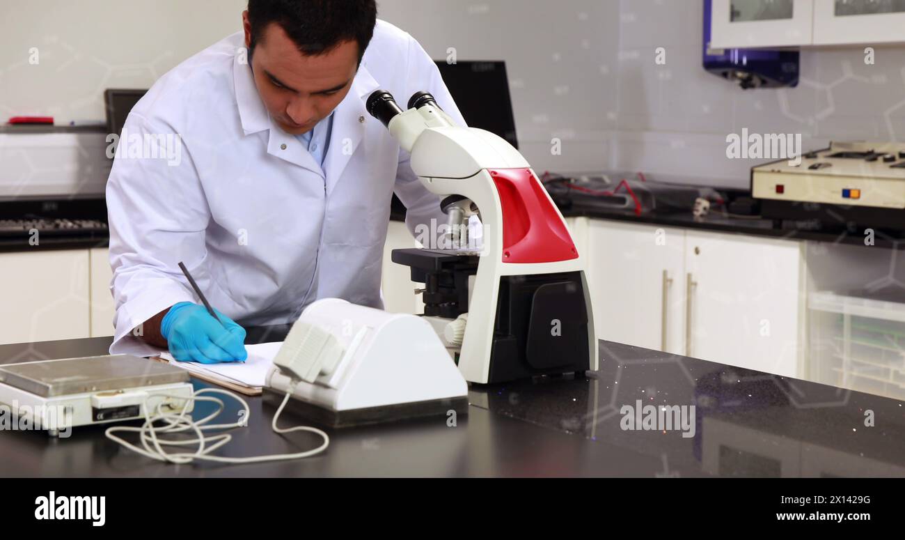 Image of chemical formulas over biracial male lab worker using microscope Stock Photo - Alamy