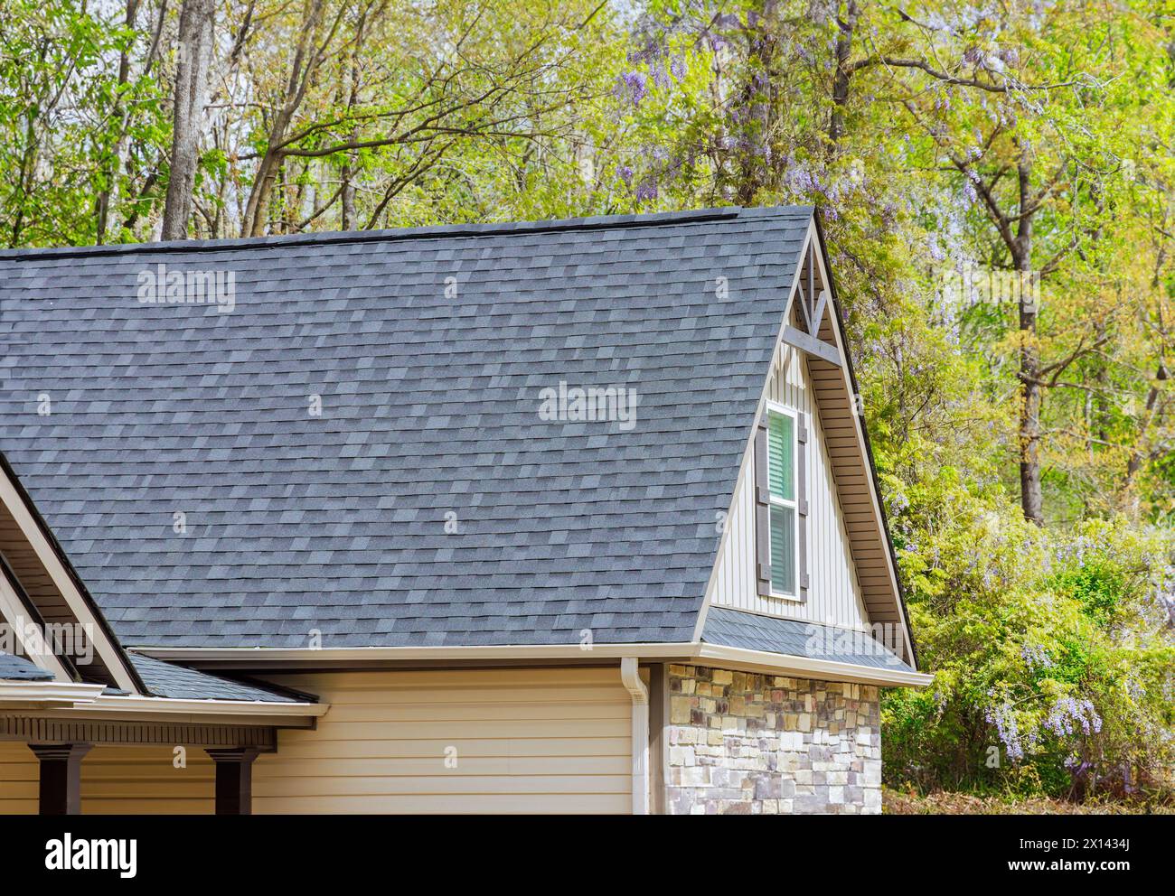 On newly constructed home, overlapping asphalt shingles are seen on ...