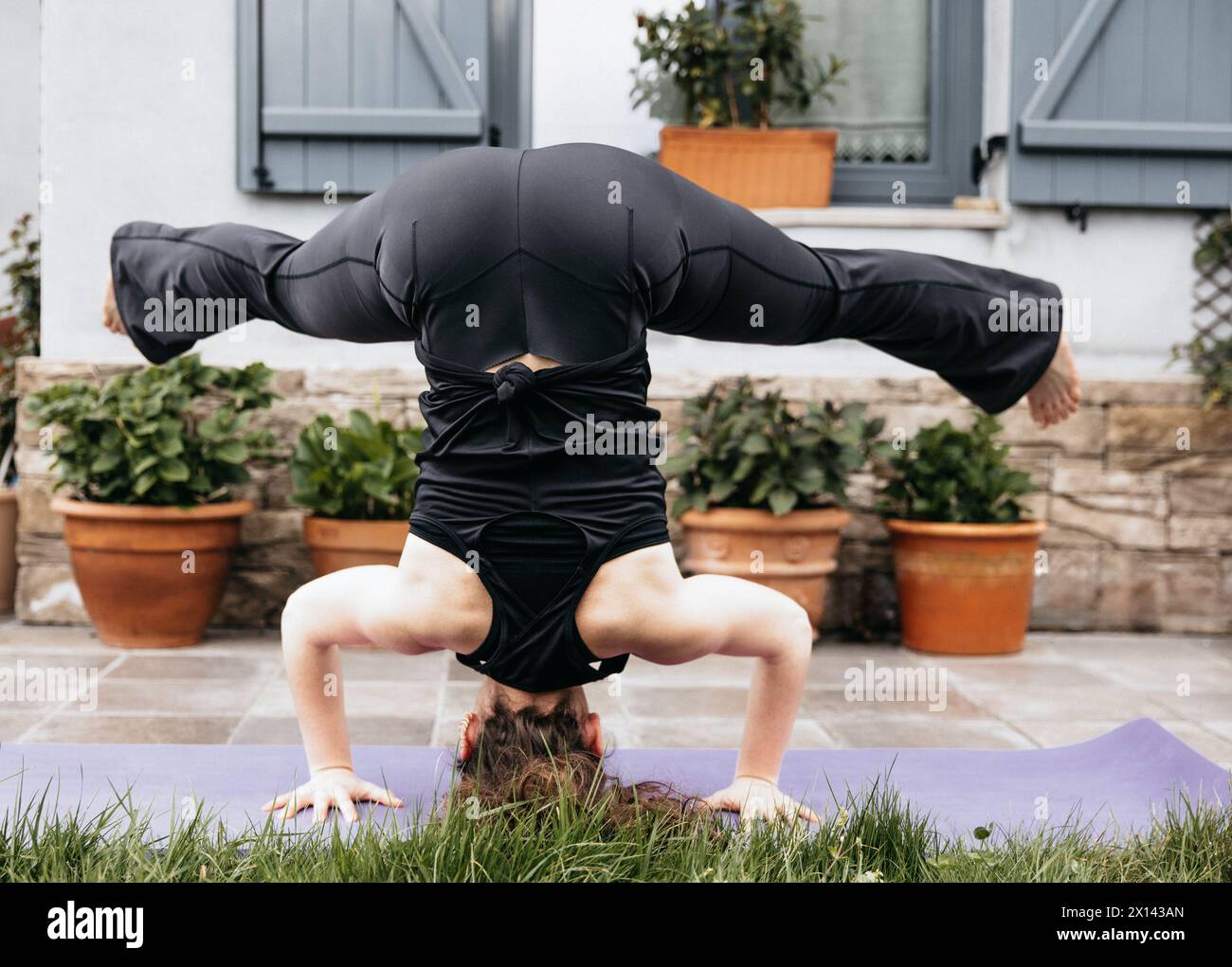Yoga practice home demonstrating advanced hi-res stock photography and ...