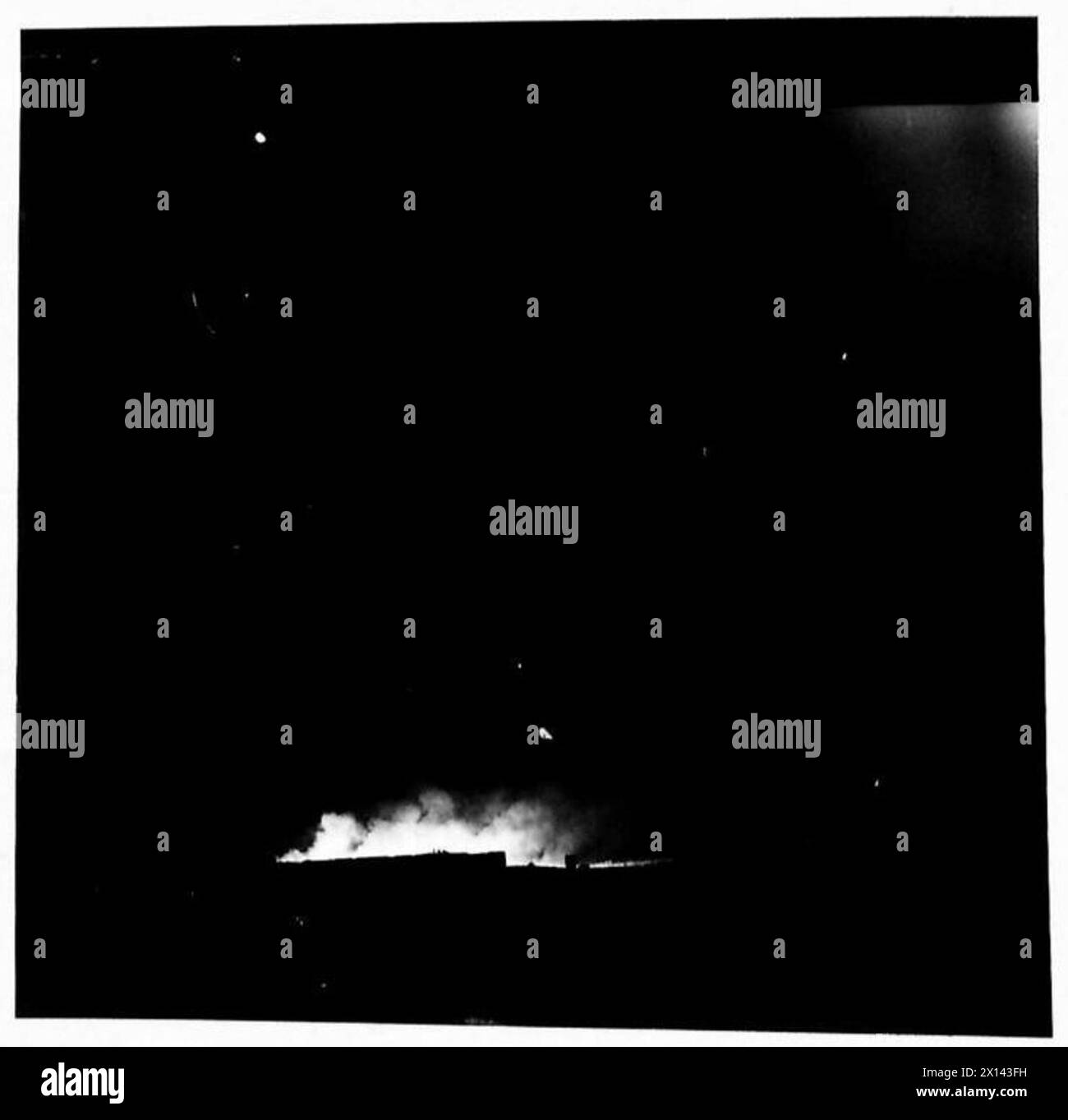 Anti-aircraft guns firing bursts during a night raid on Tobruk, British ...