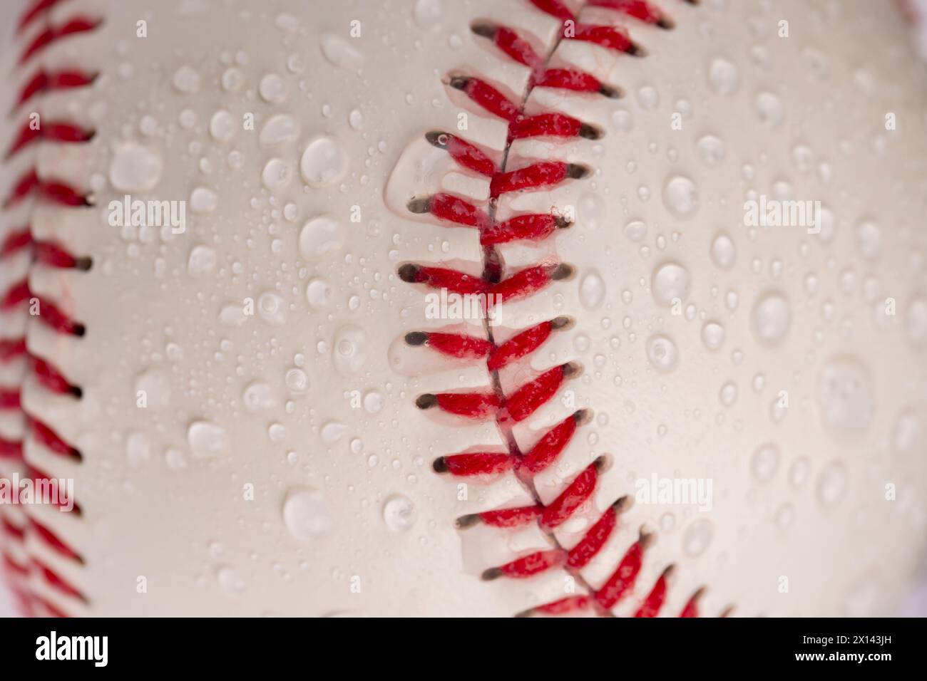 white baseball ball tied with red thread, a real round baseball ball ...