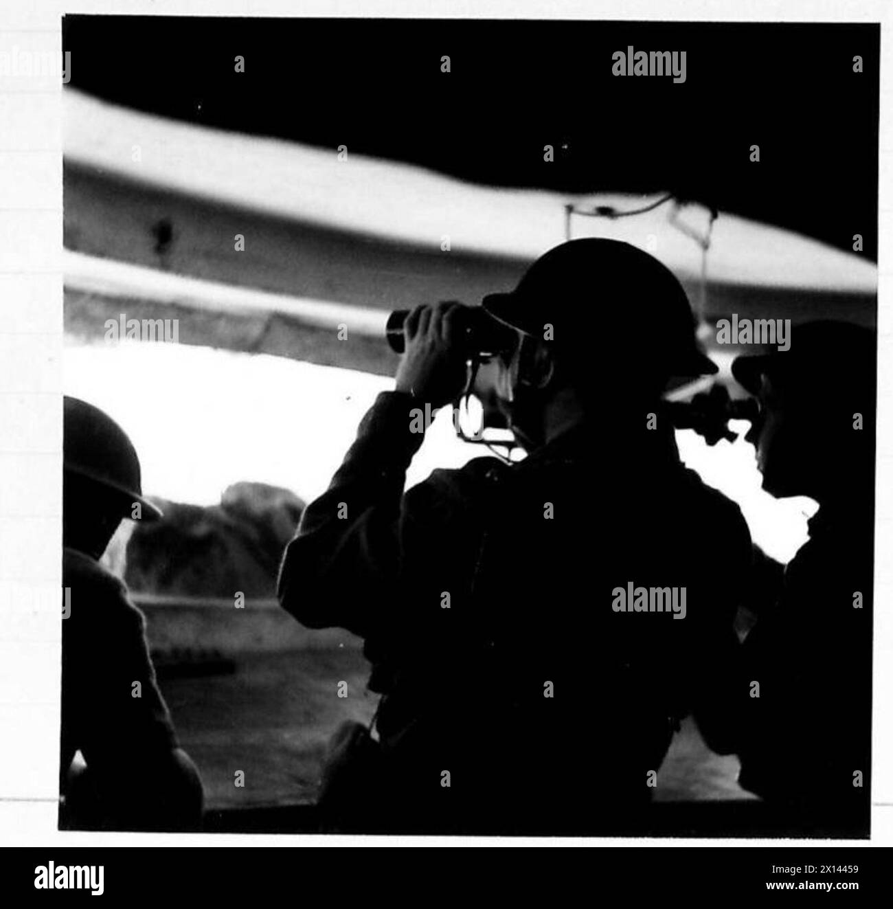 A Gun Position officer at a British coast battery in Lebanon observes ...