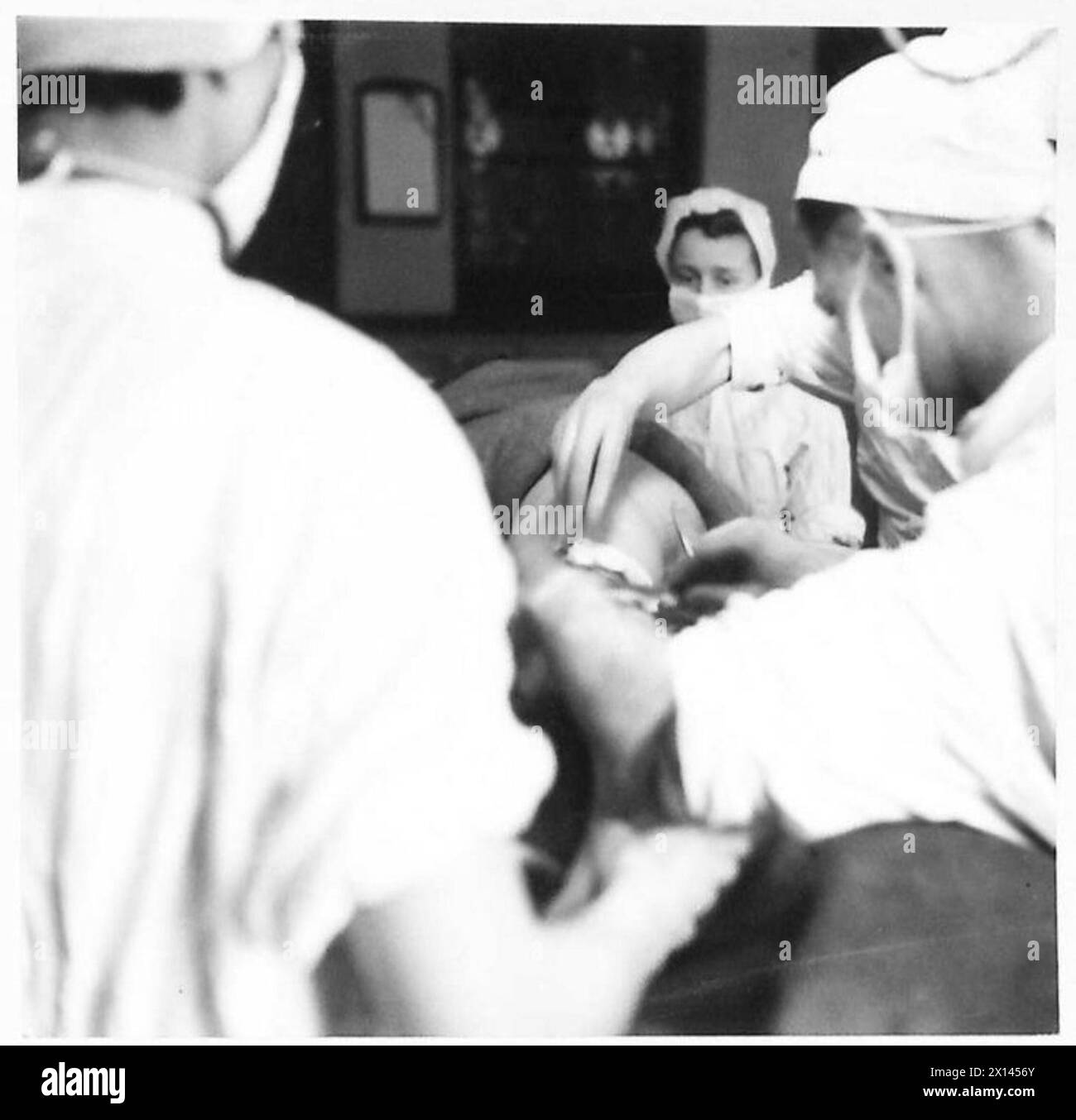During a British Army operation, a patient receives treatment for a leg ...