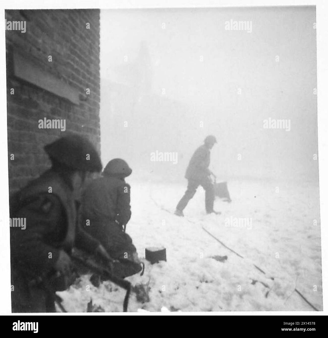 12 CORPS ATTACK - Infantry advancing through the streets of Dieteren ...