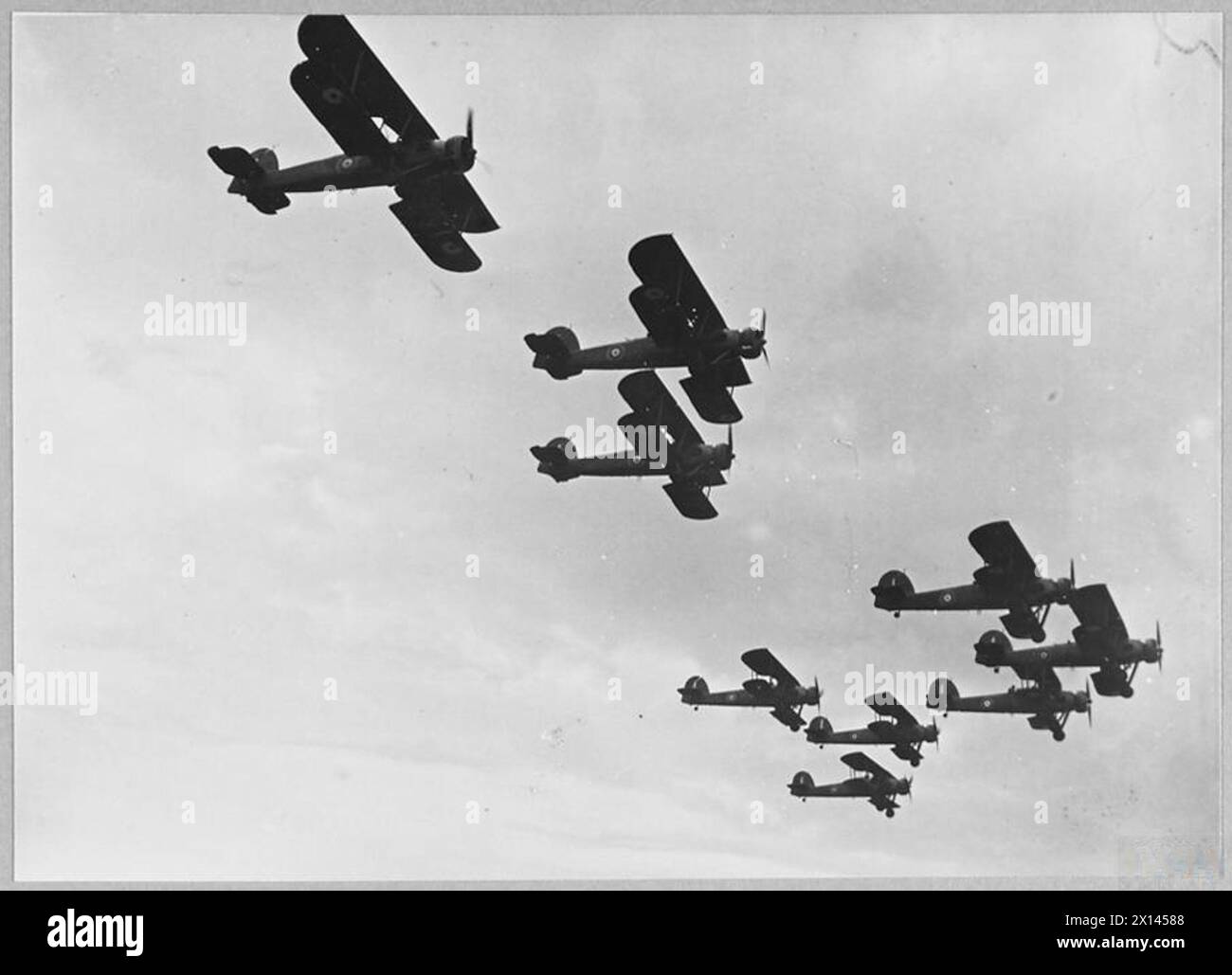 A squadron of Fairey Swordfish aircraft flying in a V-formation ...