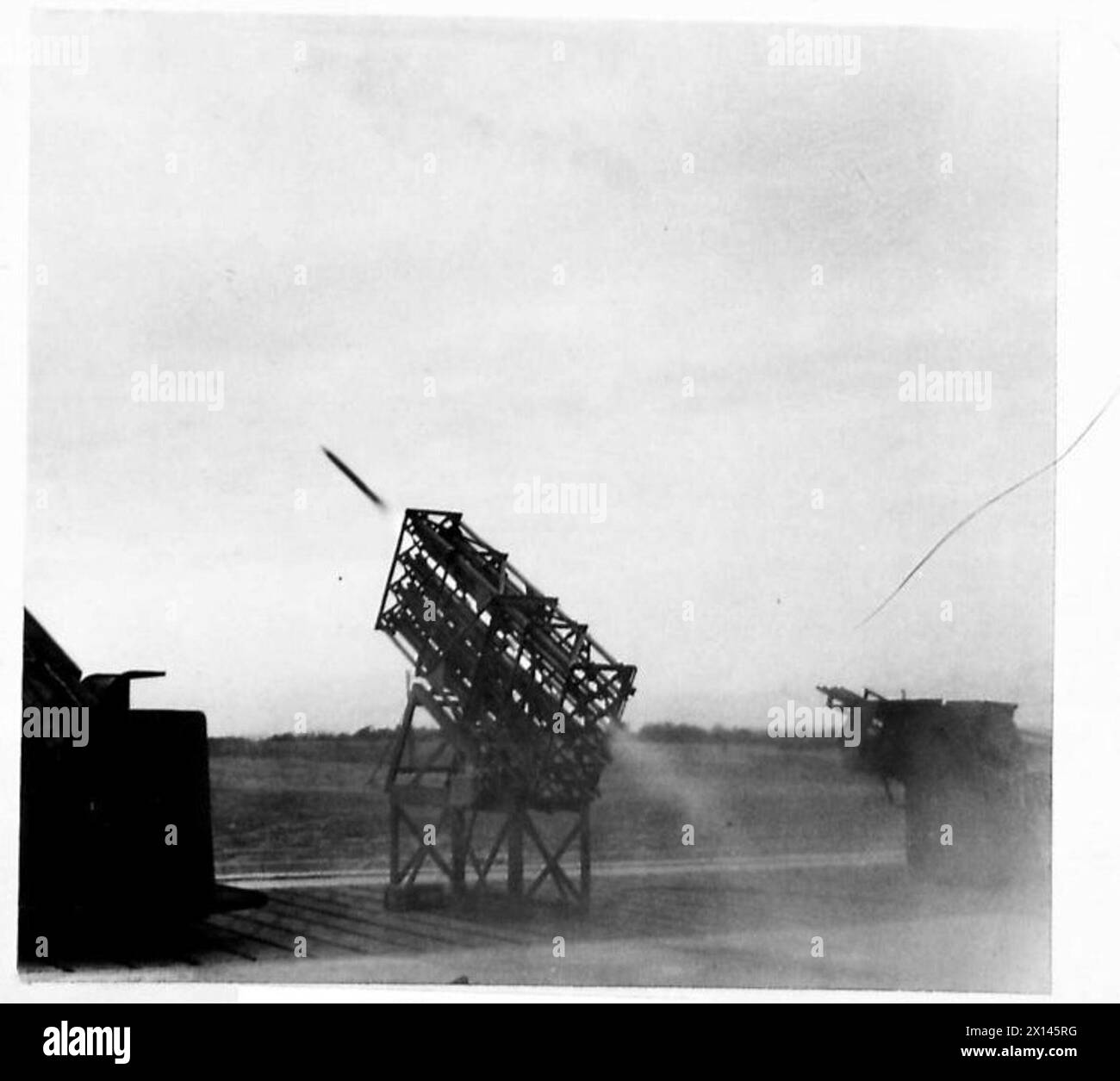 Mr. Winston Churchill observes a rocket gun, a secret weapon of the ...