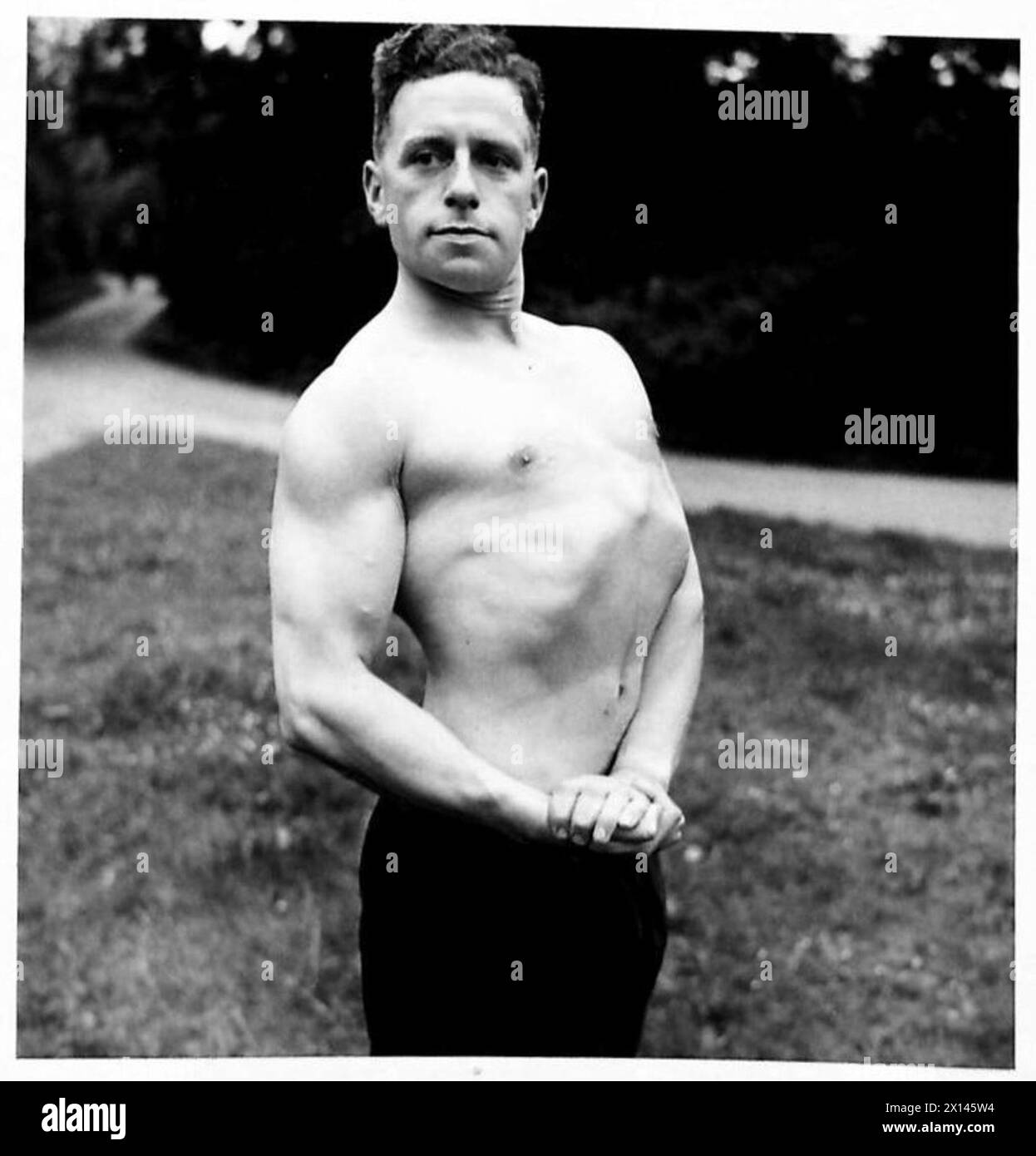 Sapper D. Lewis, previously a grocer, develops strong physique through ...