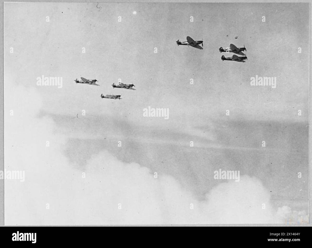 Spitfires of No. 610 Squadron from Biggin Hill fly in 'vic' formation ...