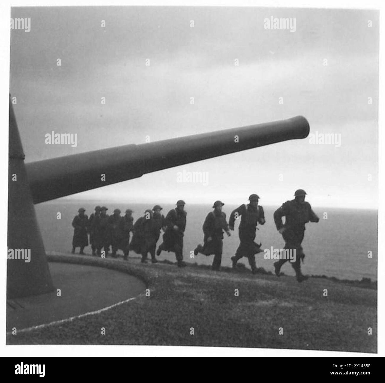 ALWAYS READY - In the gathering dusk these gunners rush to "action ...