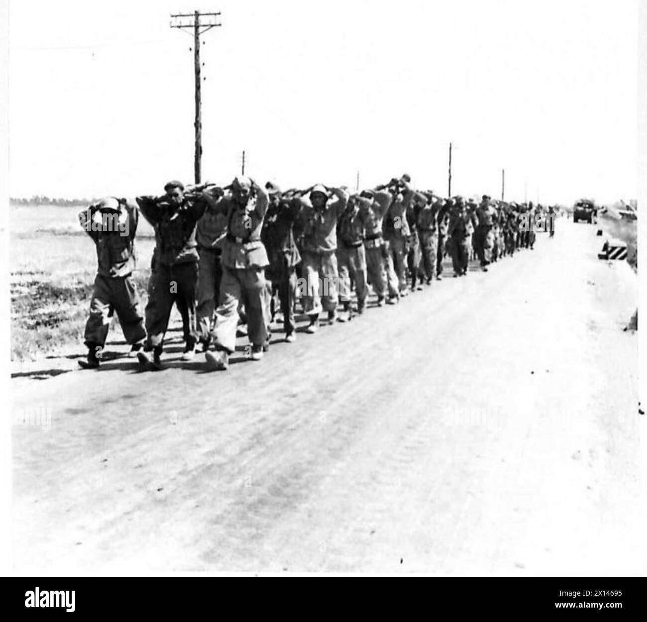 German prisoners are marched away by the British Army following the ...
