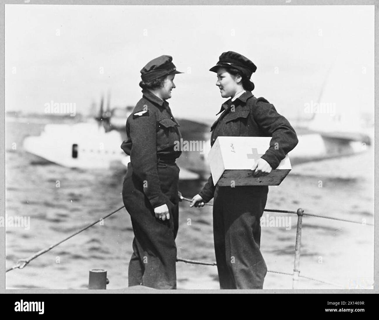 W.A.A.F. NURSES GO OUT TO FLYING BOAT TO RENDER FIRST AID TO AIRMAN ...