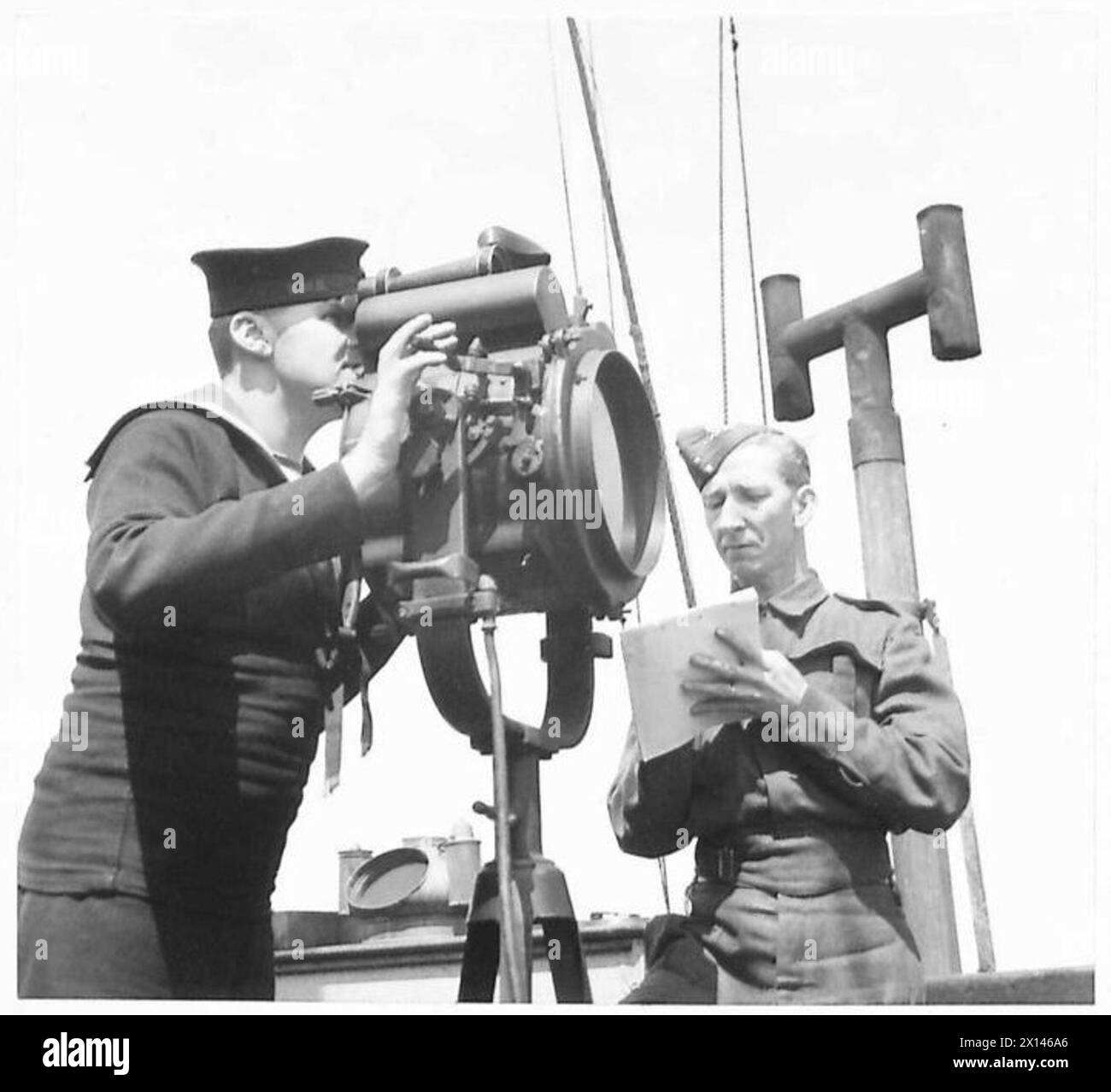 Coastal defence personnel monitor approaching craft using a 10-inch ...