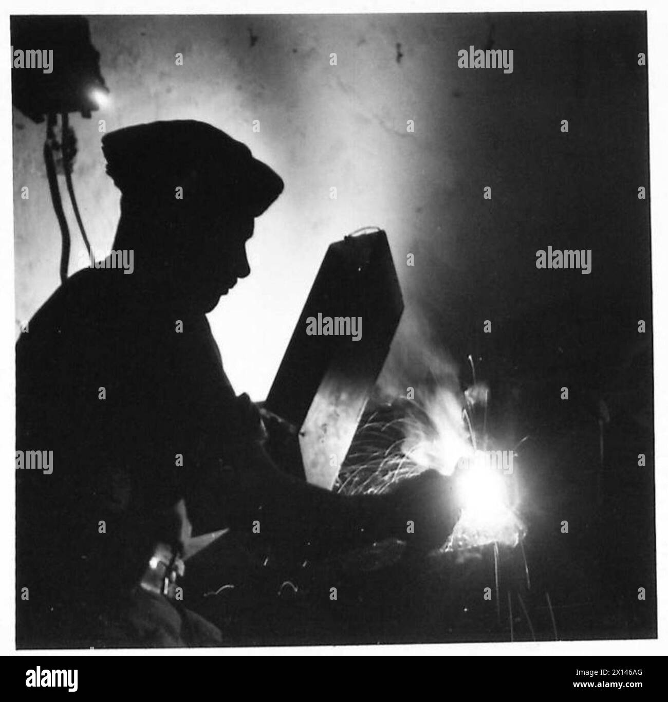 A Royal Engineers sapper welding destroyer plates in North Africa ...