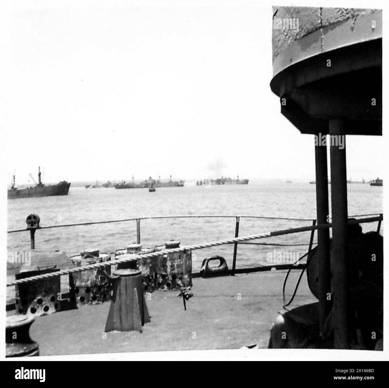 Axis aircraft drop bombs near landing craft off Sicily, producing water ...