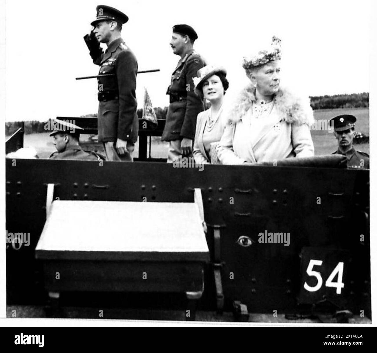 The King salutes as eight tanks of the Guards Armoured Division drive ...