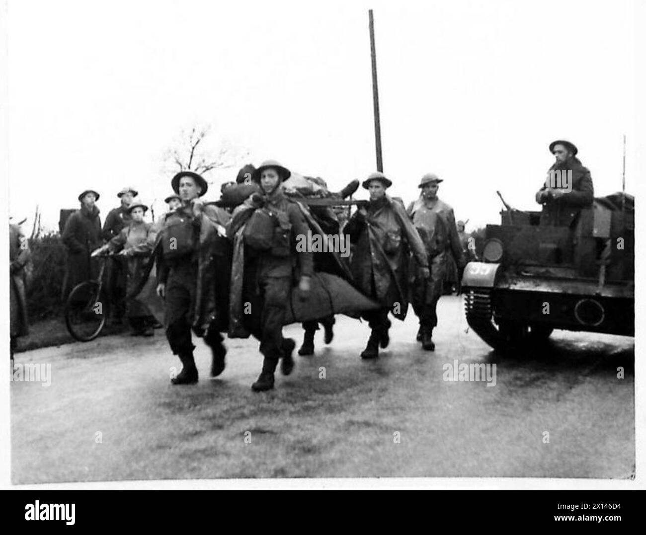 A mock battle at Park Corner, Dorset, shows a casualty being evacuated ...