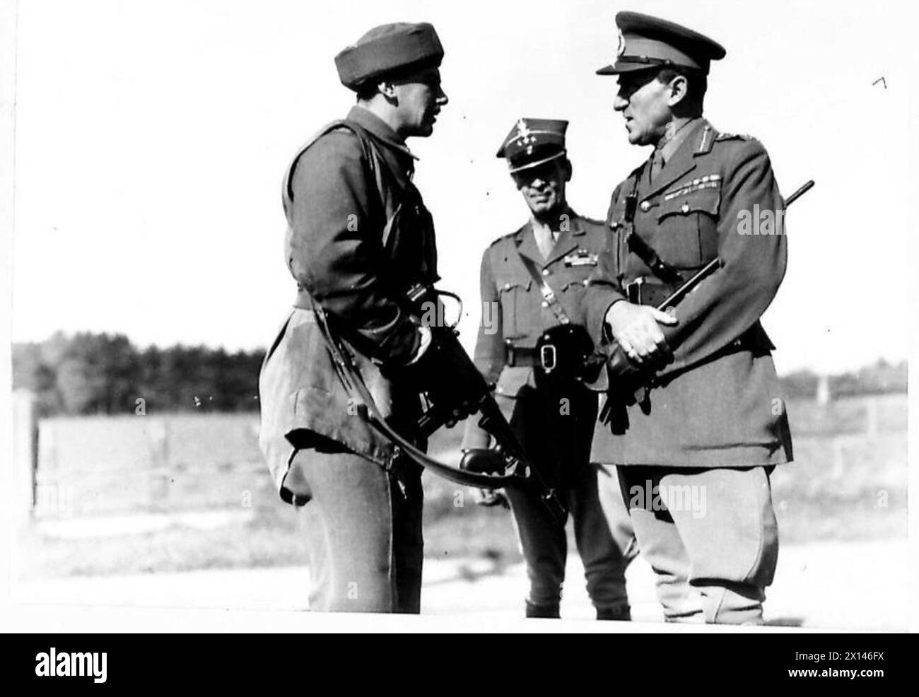 The Commander-in-Chief speaks with a Polish paratroop section leader ...