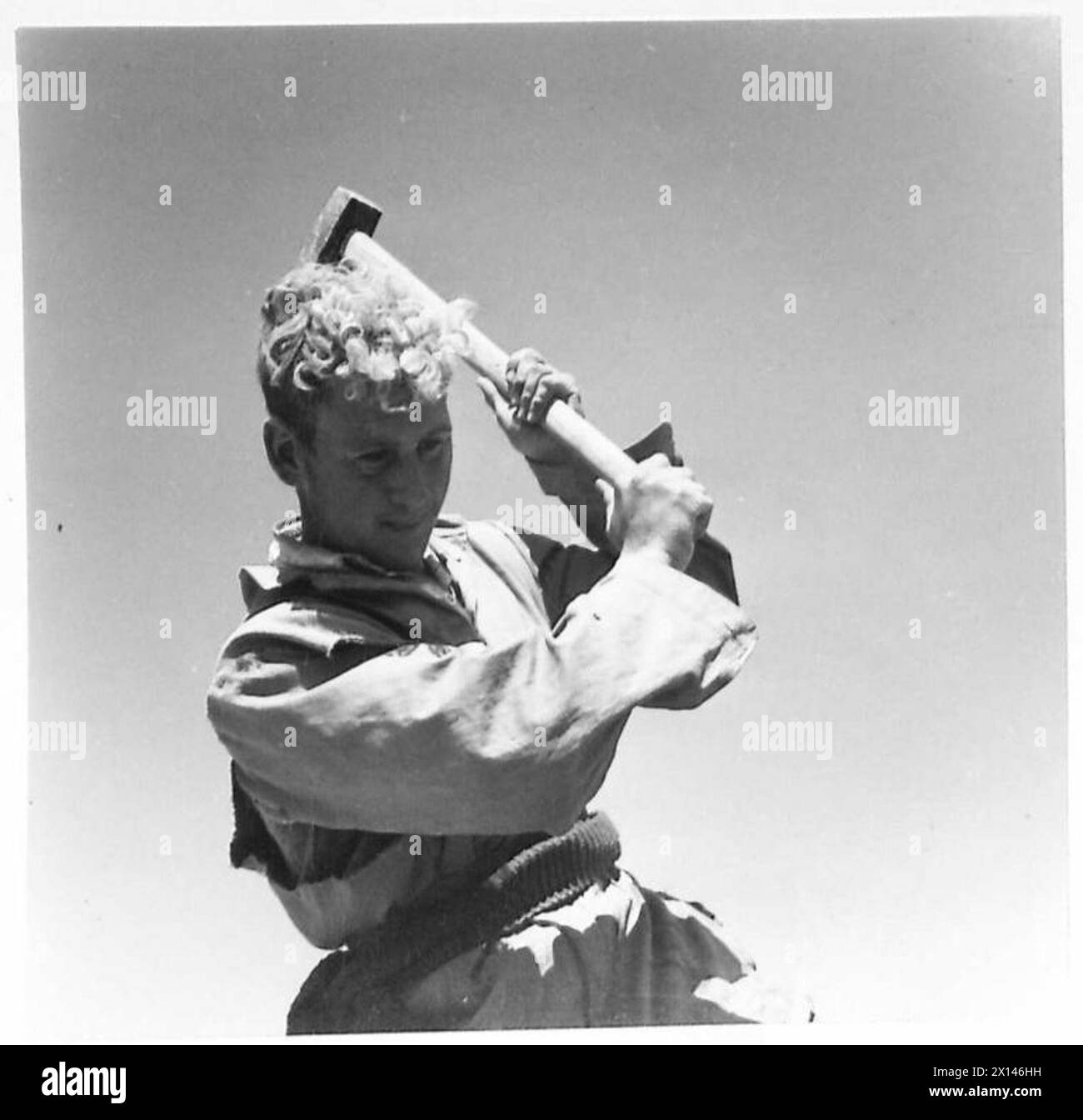 A Royal Engineers sapper, nicknamed 'Blondie', constructs a new road ...