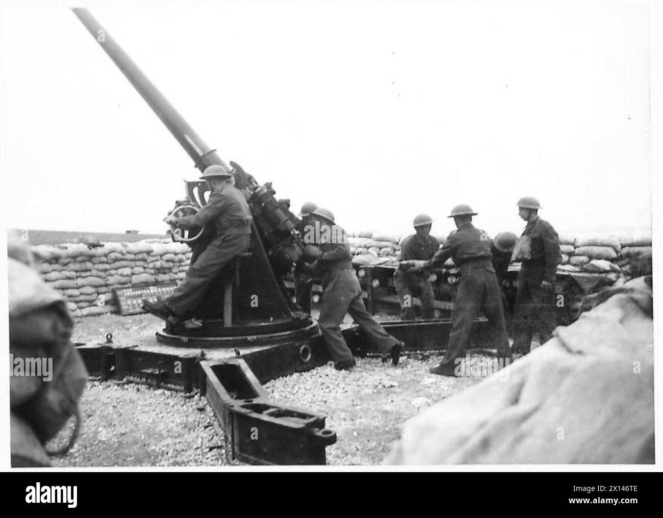 WITH AN A.A. BATTERY - 3 inch Anti-aircraft Gun in action with a Heavy ...