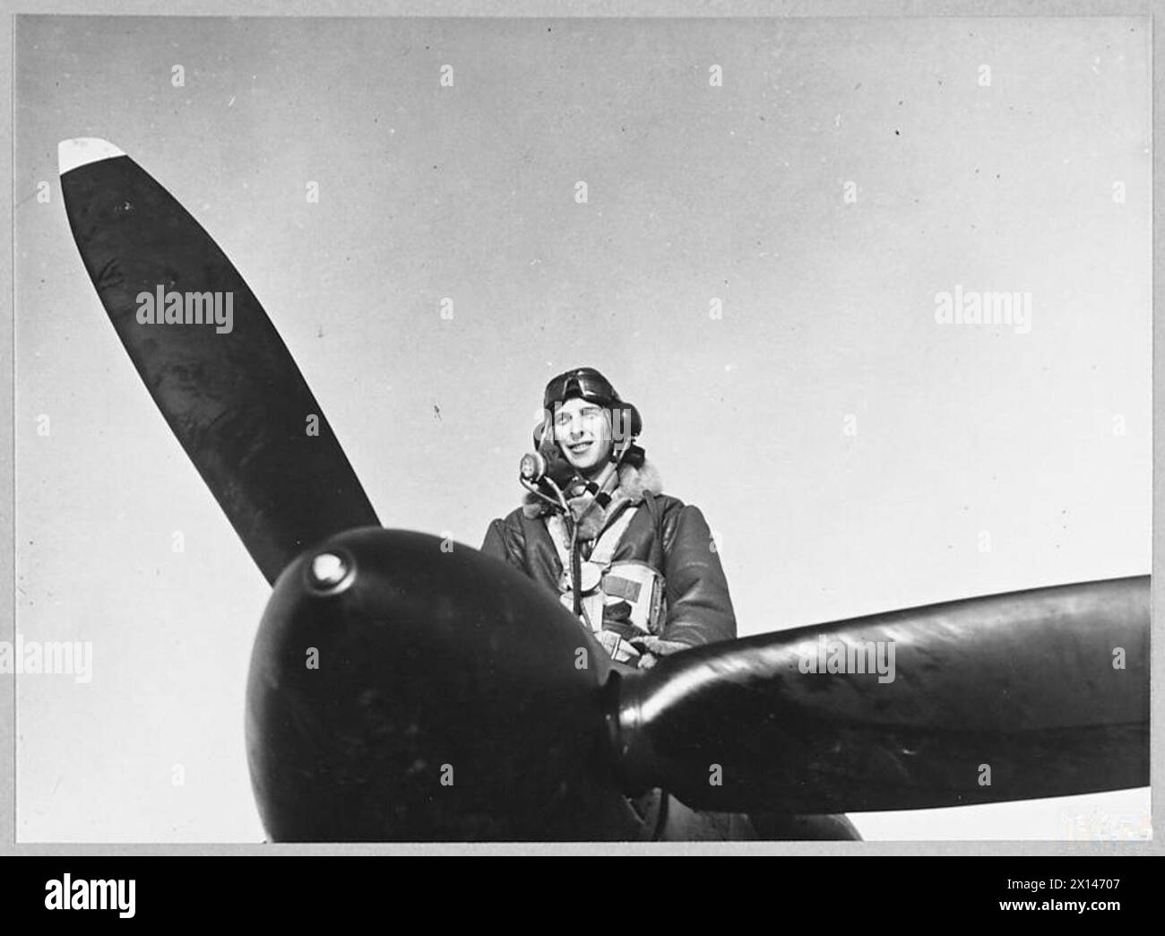 In November 1940, a No. 87 Squadron pilot is pictured seated on the ...