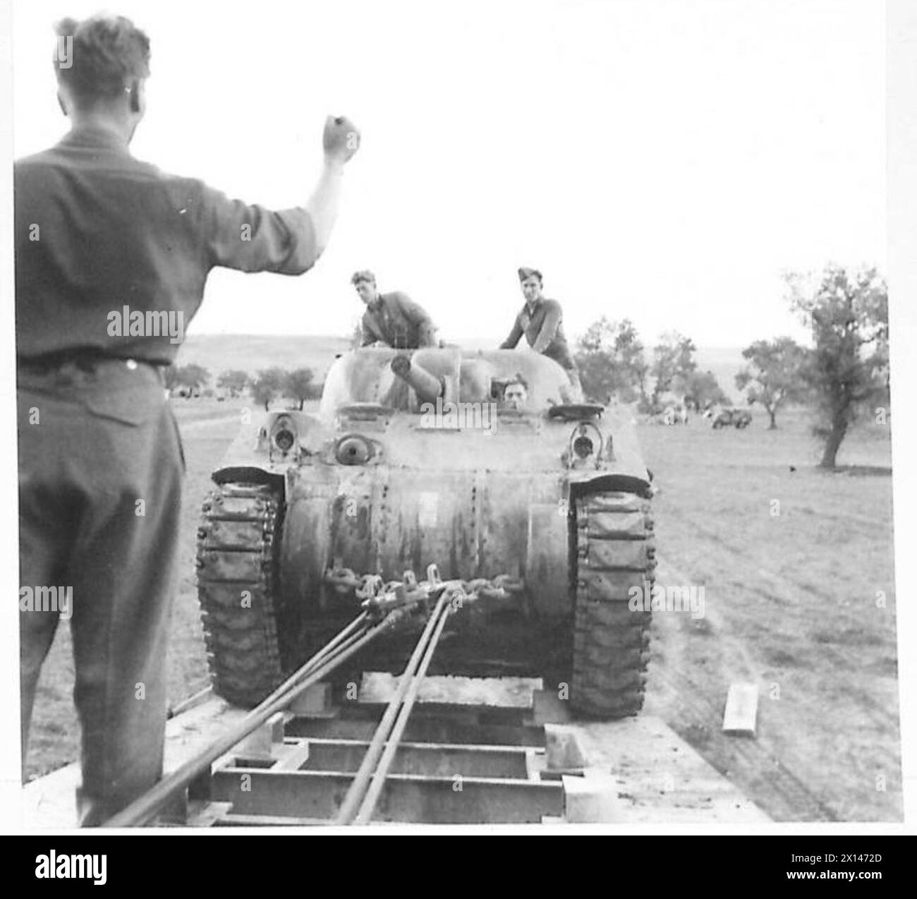 The Eighth Army REME unit recovers a Sherman tank, loading it onto a ...
