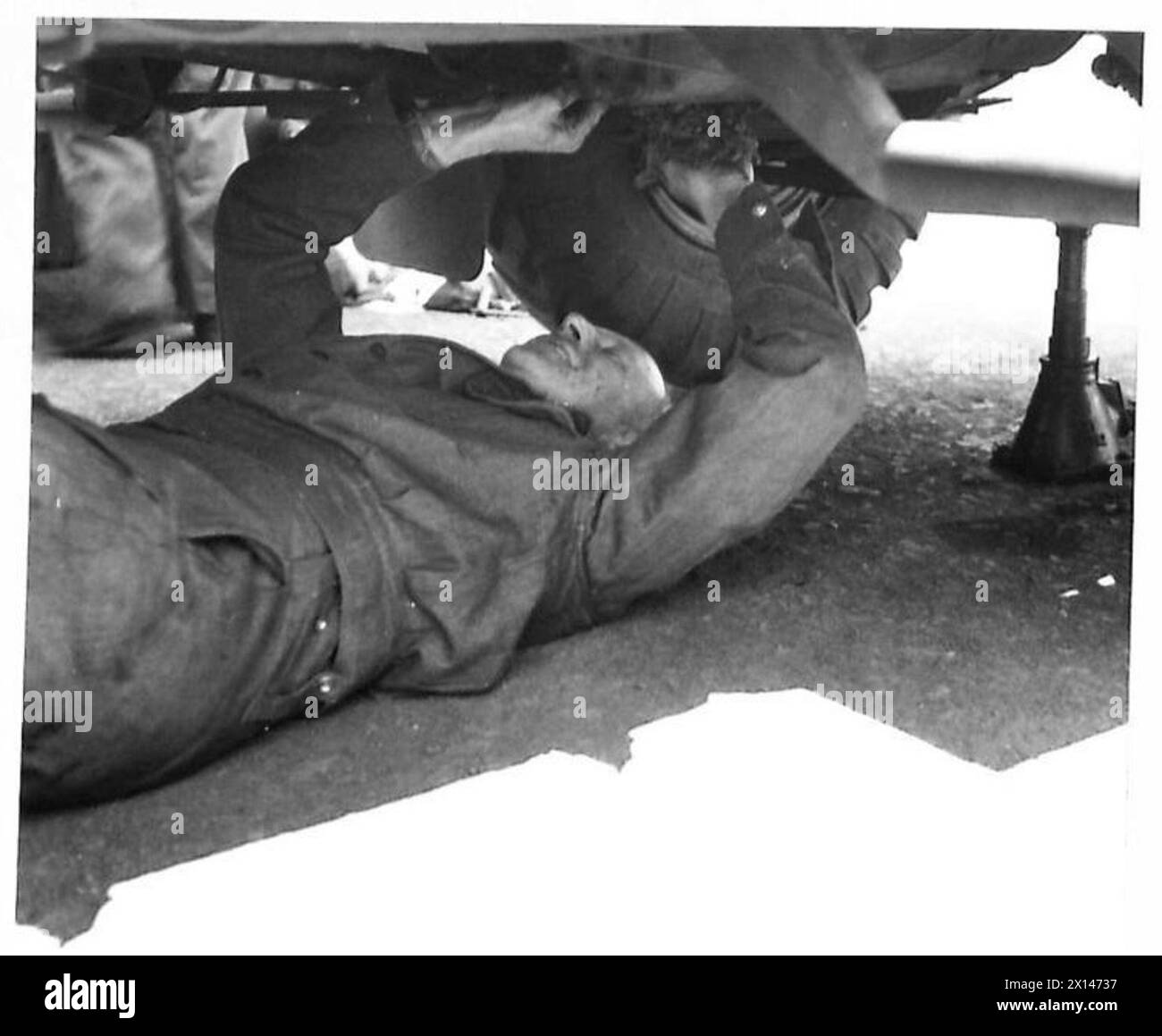 A colonel performs maintenance on one of his vehicles as part of ...