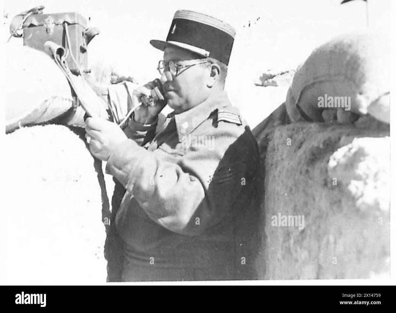 A French Battalion Commander gives instructions from his trench to Free ...