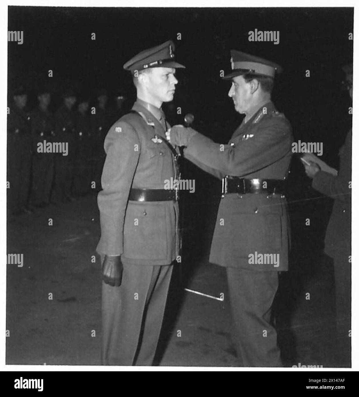 Major T.B. Holm of Norway receives the O.B.E. from General Sir Bernard ...