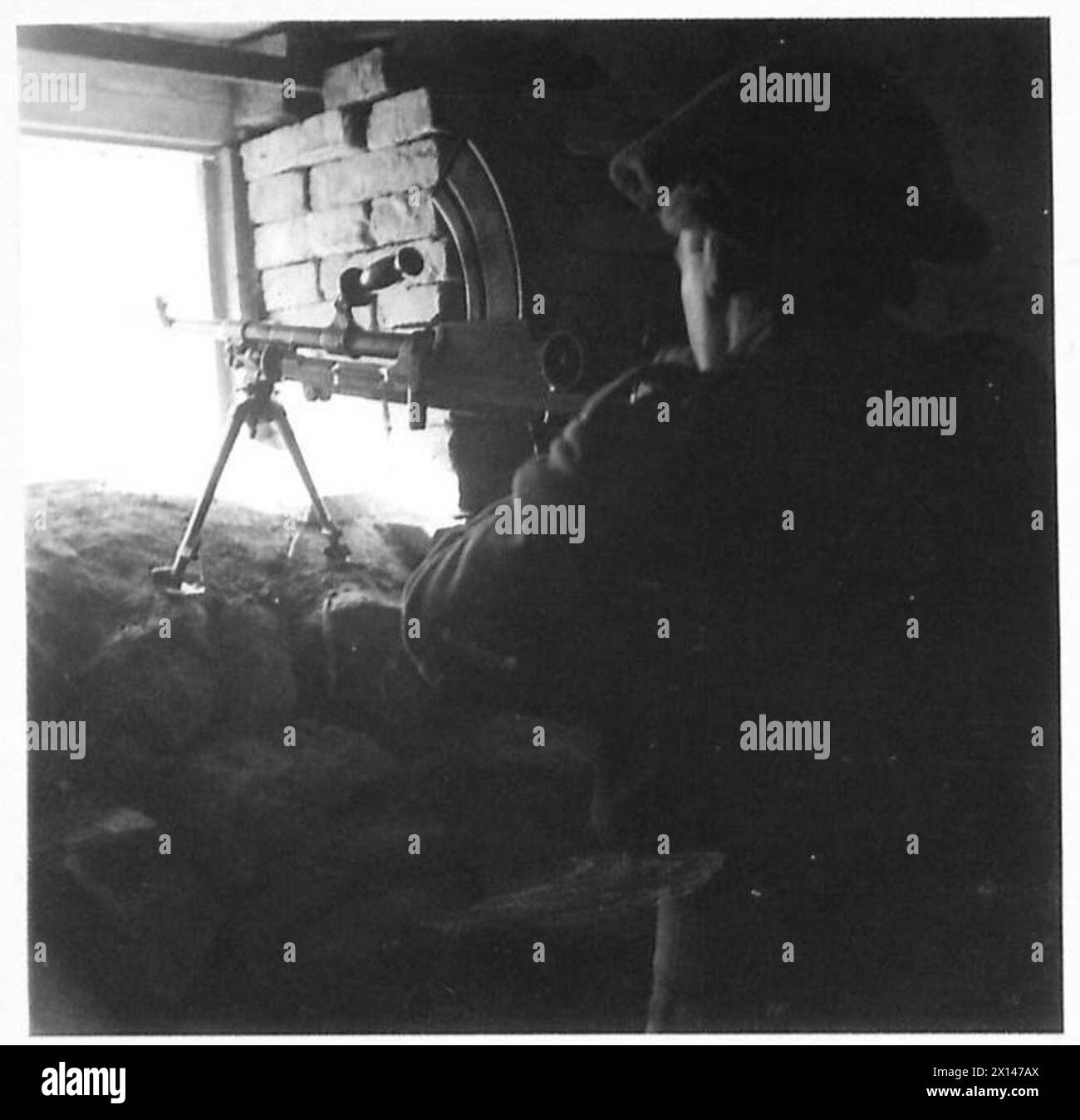 Private D.T. Lewis of the 22nd Motor Battalion, 4th Brigade, covers ...