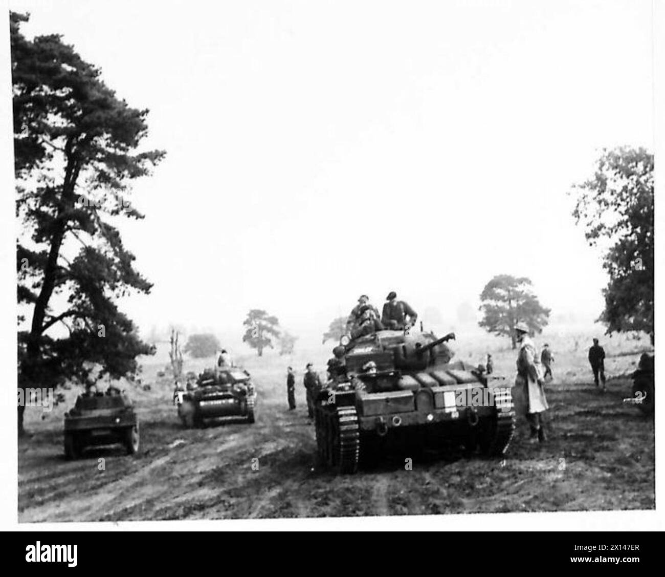 Tank officers are seen in conference during a lull in a large-scale ...