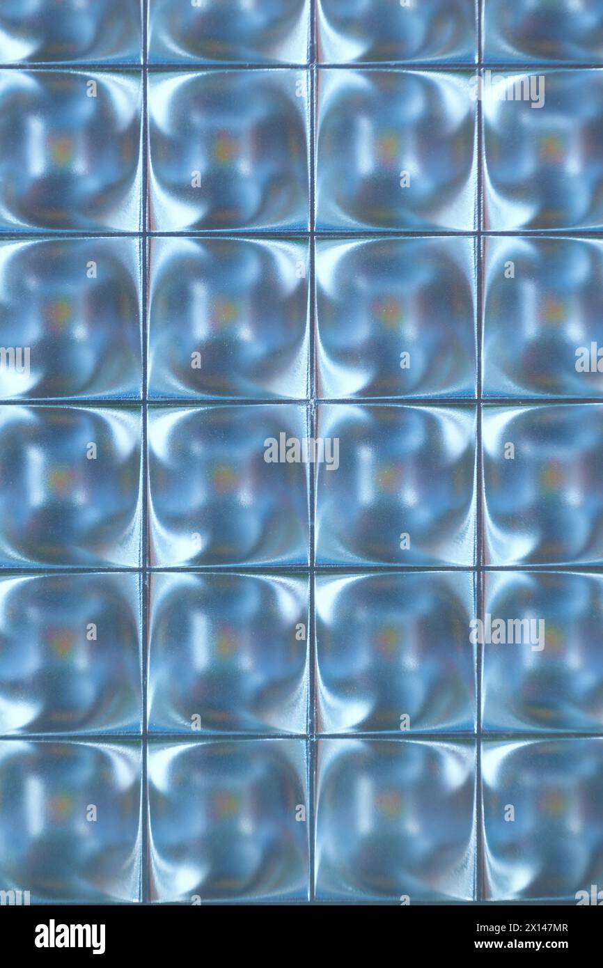Small shiny square tiles, close-up. Unusual backgrounds and textures ...