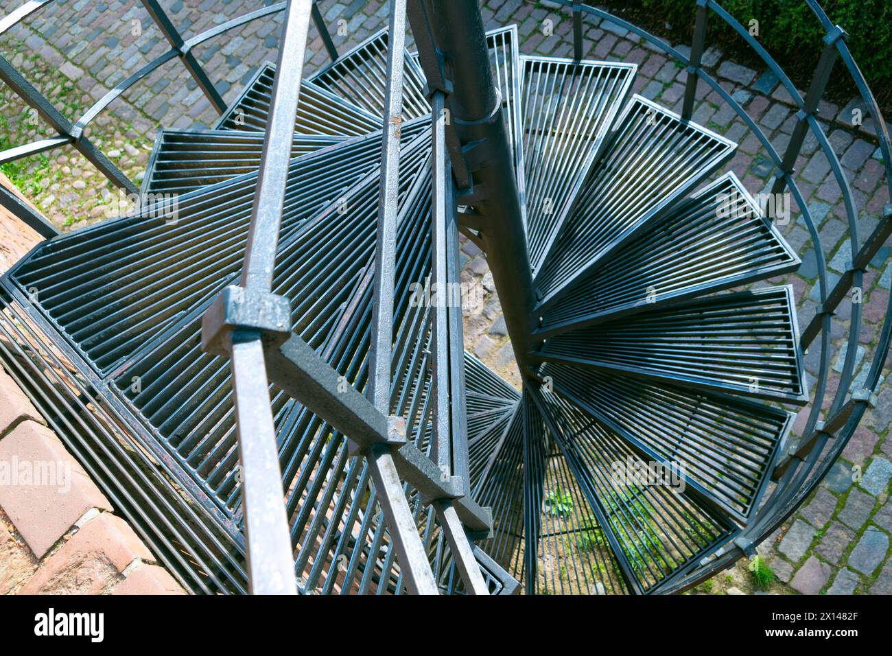 Spiral metal staircase outside the building. Details and elements of ...