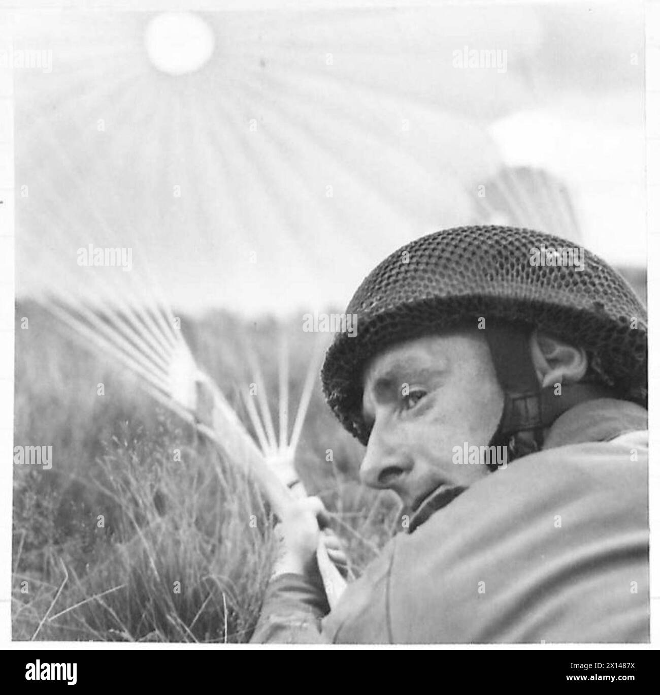 PARATROOPS IN TRAINING - Paratroop keeping a sharp look-out for the ...